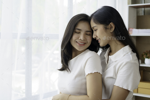 Asian lesbian couple, LGBTQ. Happy Two young Asia women showing love and romance together at ...